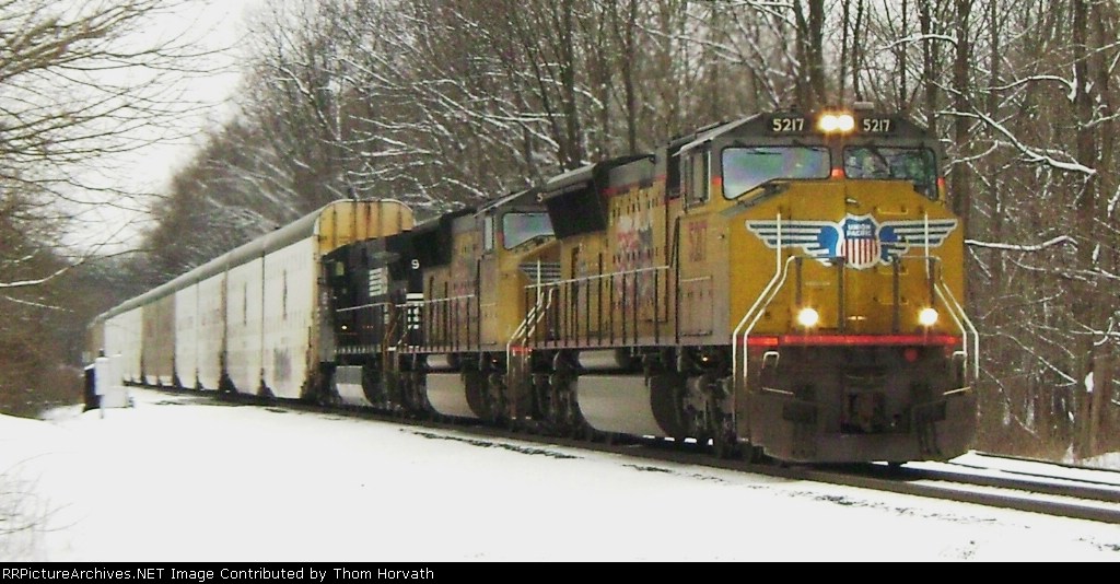 On this overcast day, UP 5217 is the leader for NS's 212